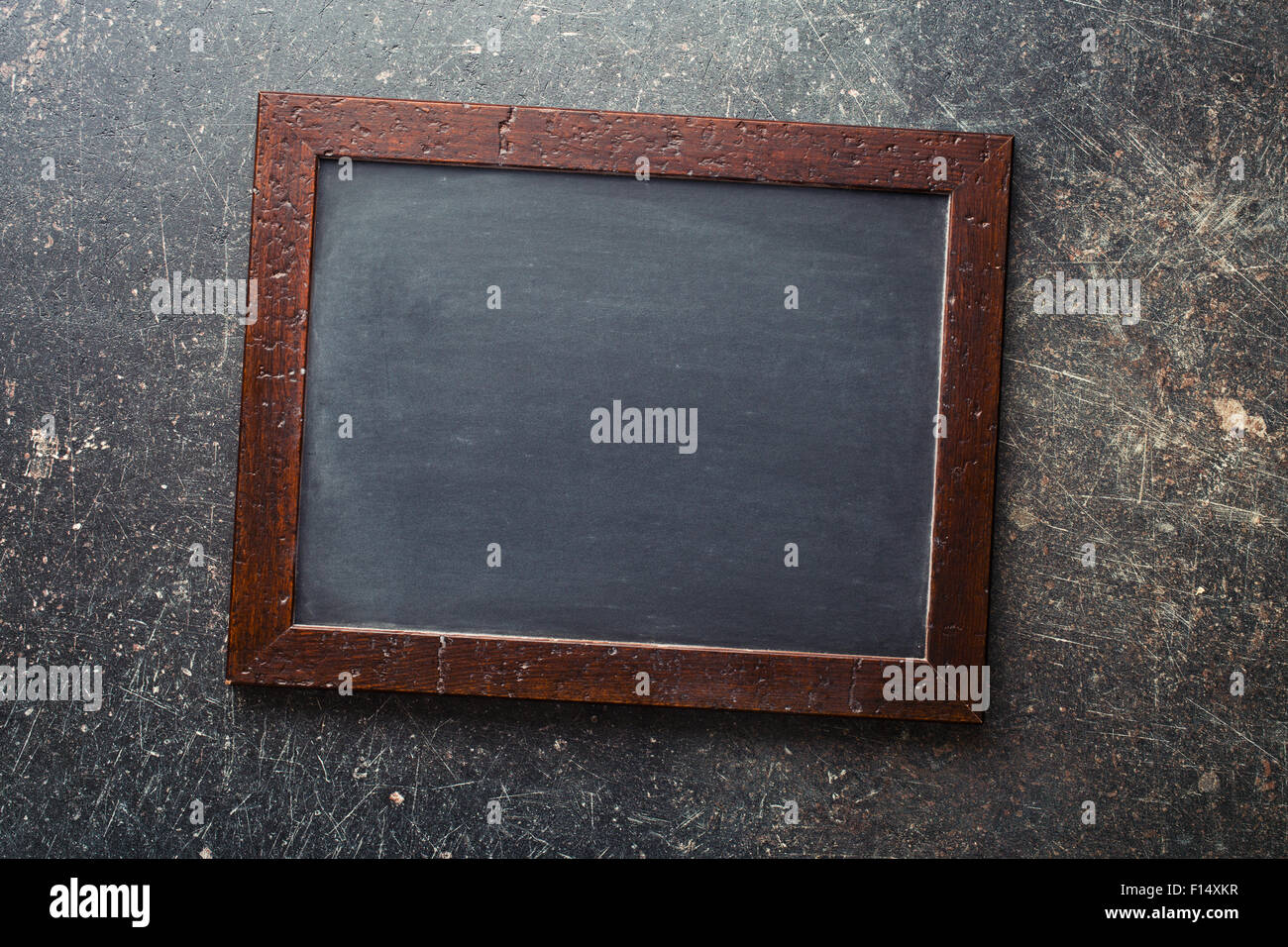 vintage chalkboard on old work table Stock Photo - Alamy
