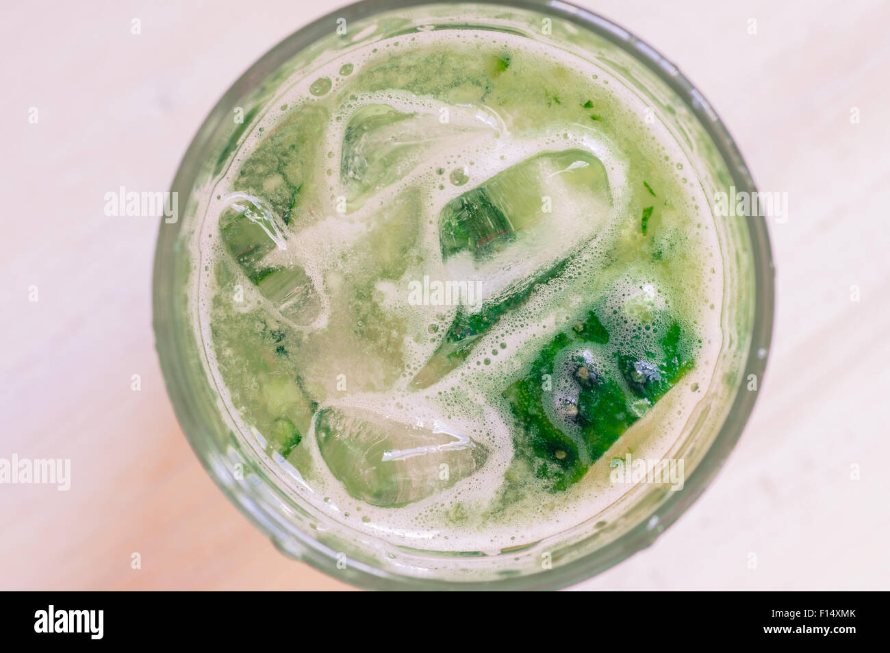 Cucumber water with ice in a glass top view Stock Photo - Alamy