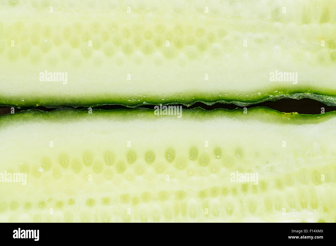 Background of the cut cucumber close up top view Stock Photo - Alamy