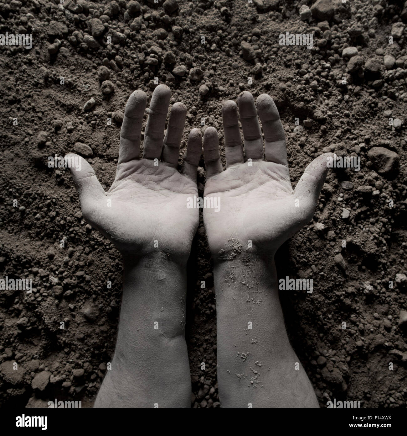Hands against dirt Stock Photo - Alamy