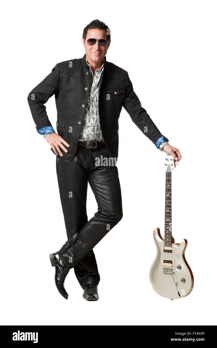 Man standing in studio with electric guitar Stock Photo - Alamy