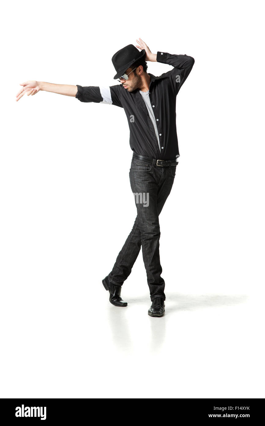 Man in fedora dancing in studio Stock Photo - Alamy
