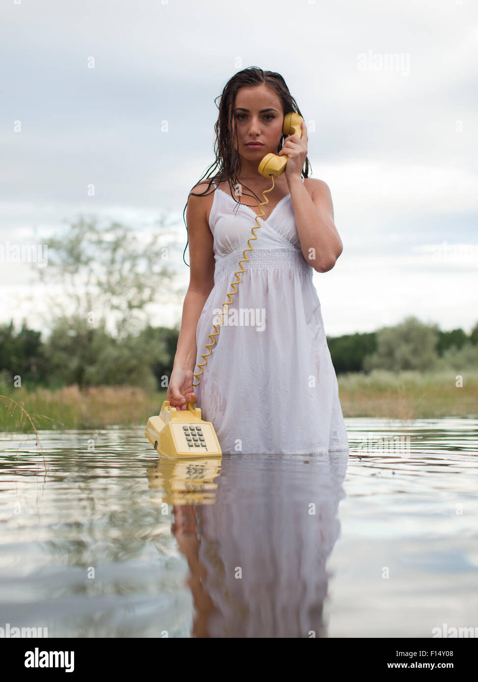 Woman wading lake dress hi-res stock photography and images - Alamy