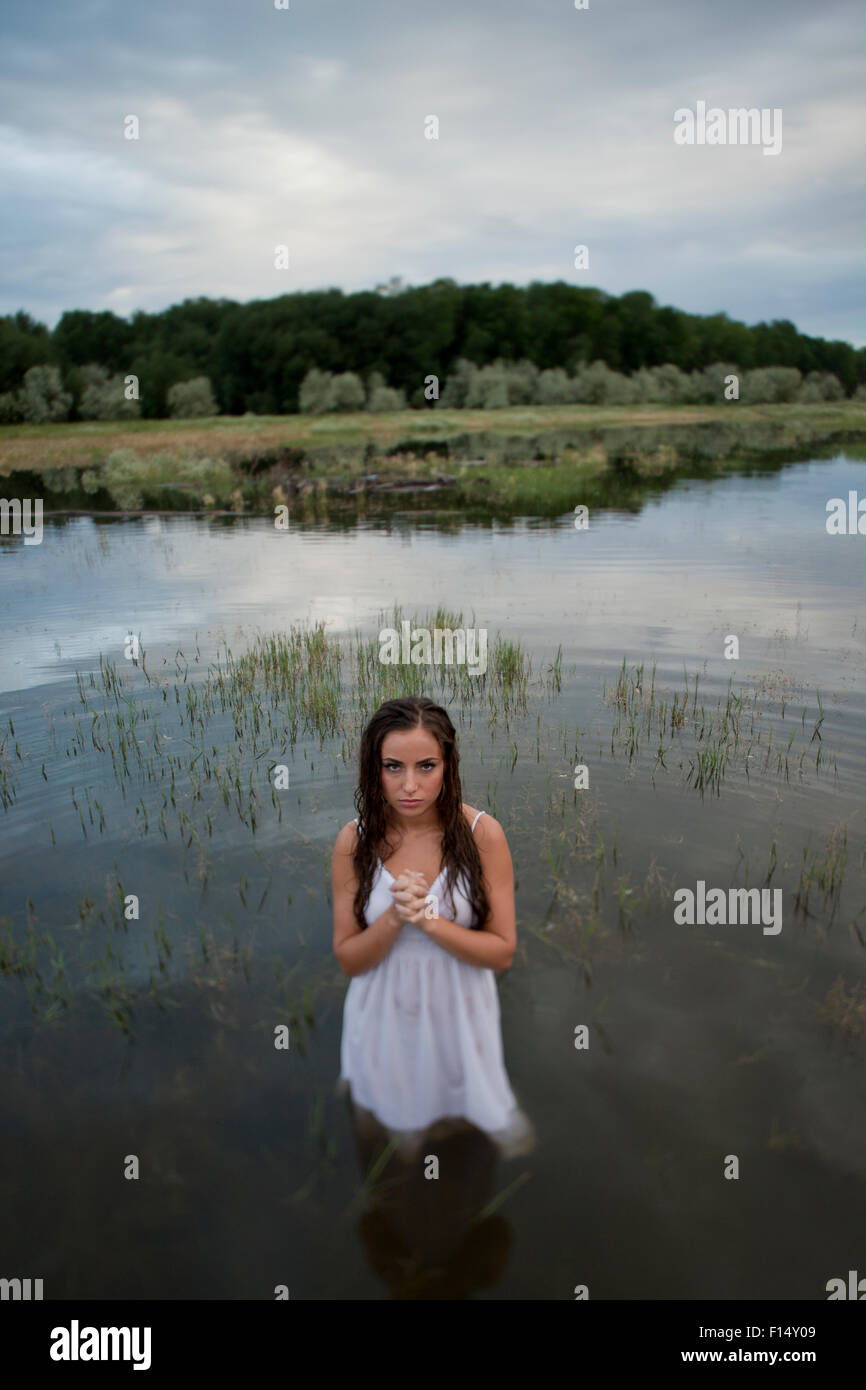 Woman wading lake dress hi-res stock photography and images - Alamy