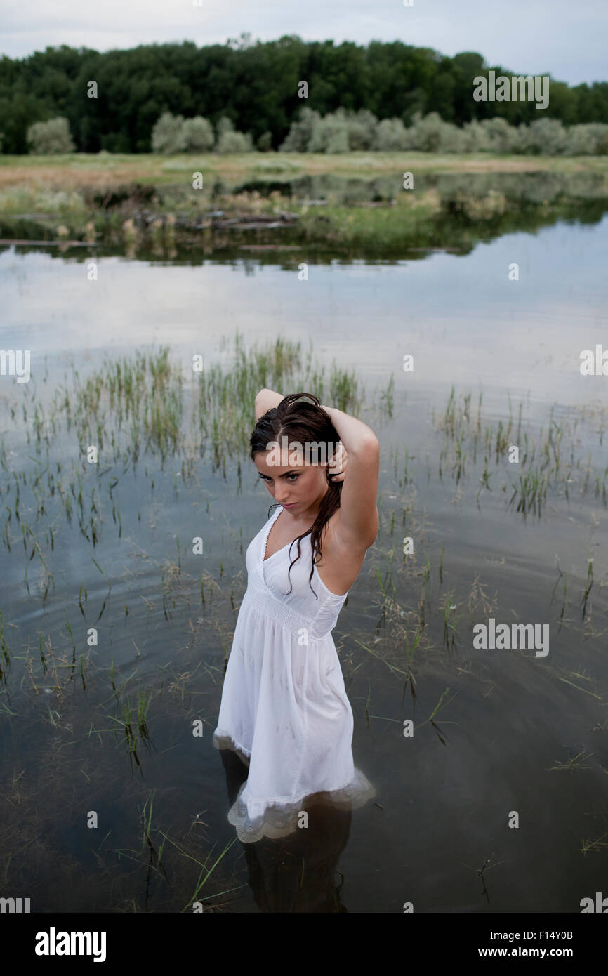Woman in dress wading in water hi-res stock photography and images - Alamy