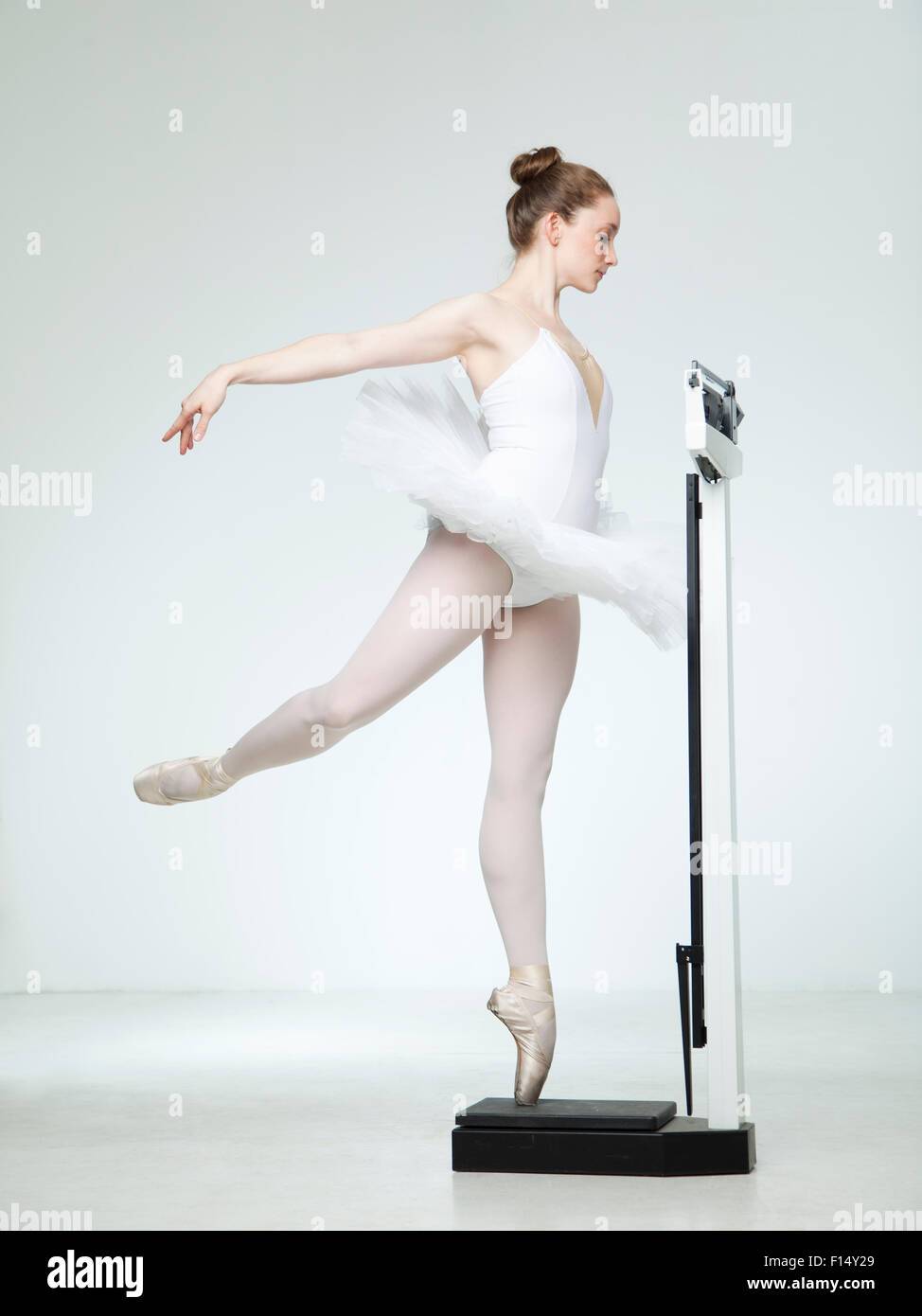 Studio shot of ballet dancer dancing on weight scale Stock Photo - Alamy