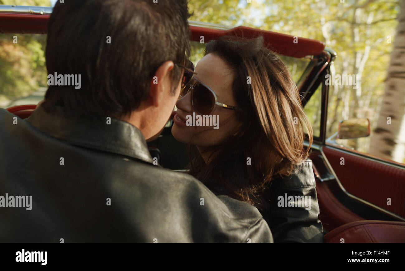 Romantic couple in convertible Stock Photo - Alamy