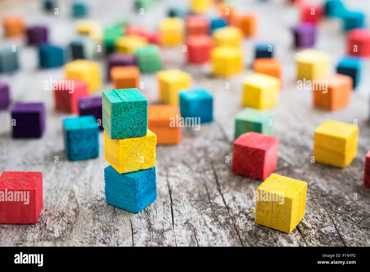 Colorful wooden building blocks. Selective focus Stock Photo - Alamy
