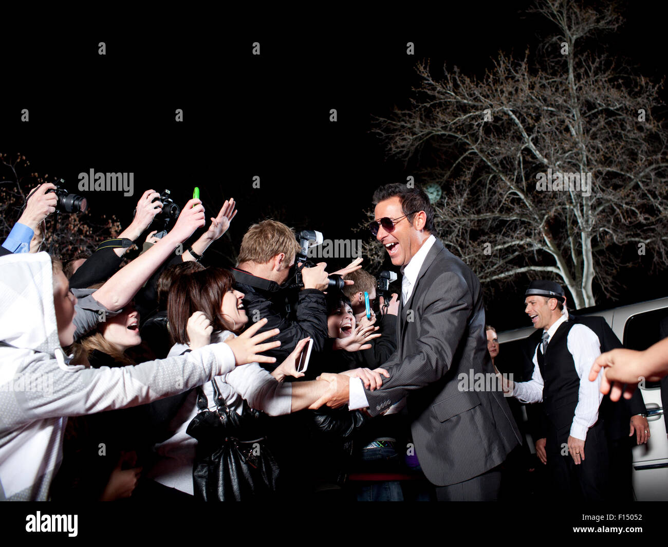 USA, Utah, Provo, Paparazzi photographing famous man Stock Photo - Alamy
