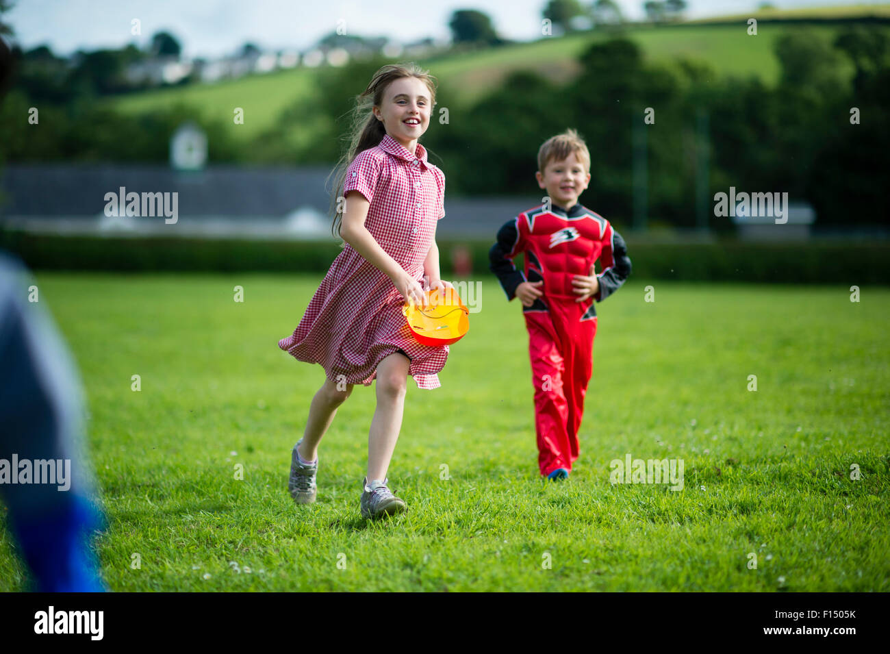Childhood Games: Pre-teen primary school age children playing outdoors ...