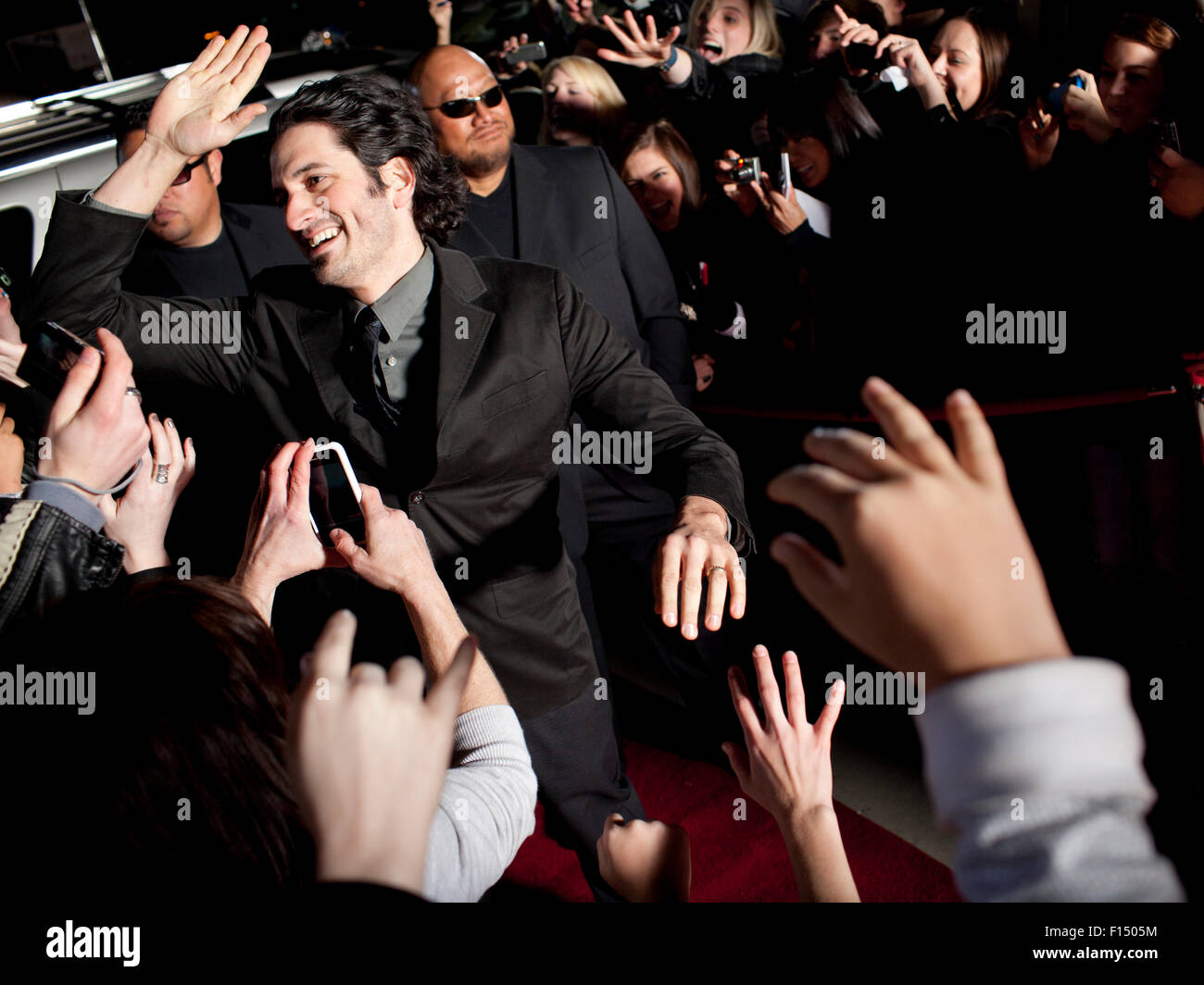 USA, Utah, Provo, Paparazzi photographing famous man Stock Photo - Alamy