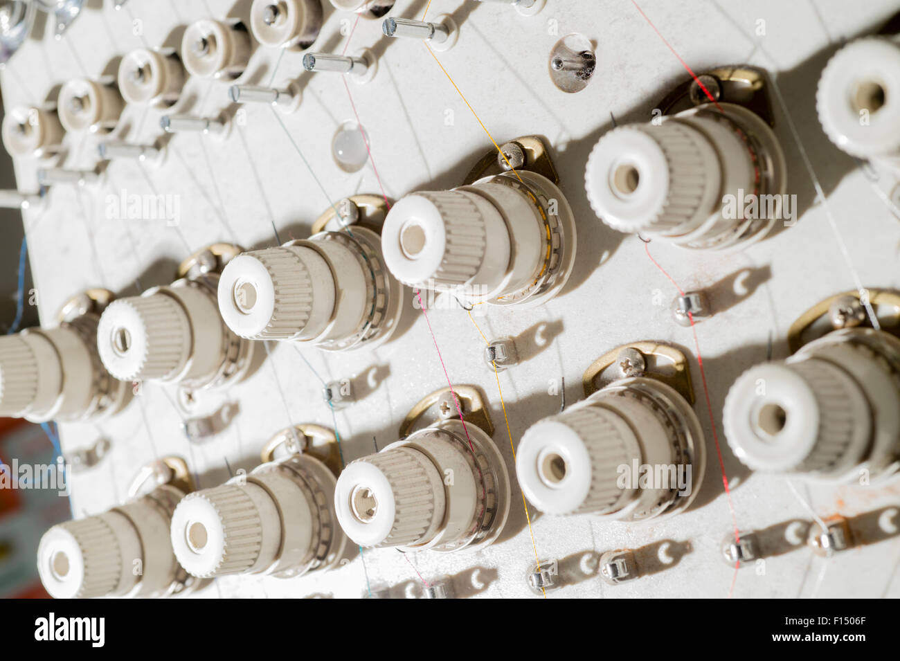 Close up detail of the thread tensions knobs on a machine used in a ...