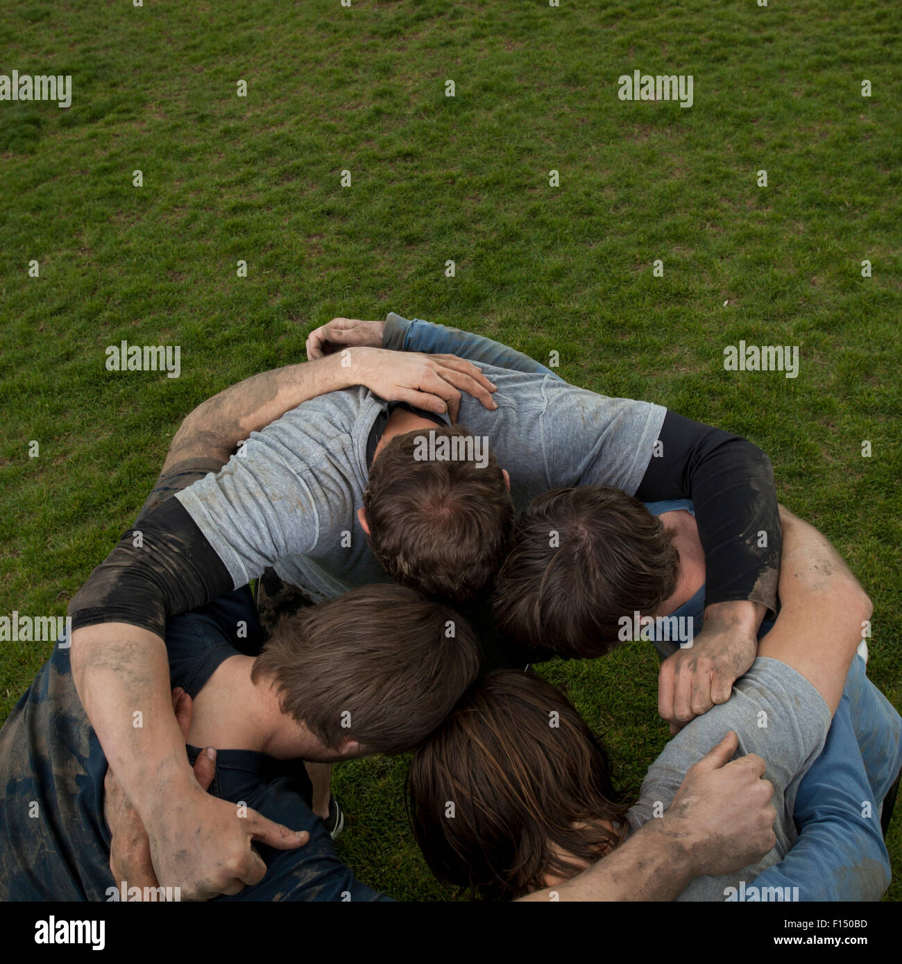 USA, Utah, Provo, Friends embracing in football pitch Stock Photo - Alamy