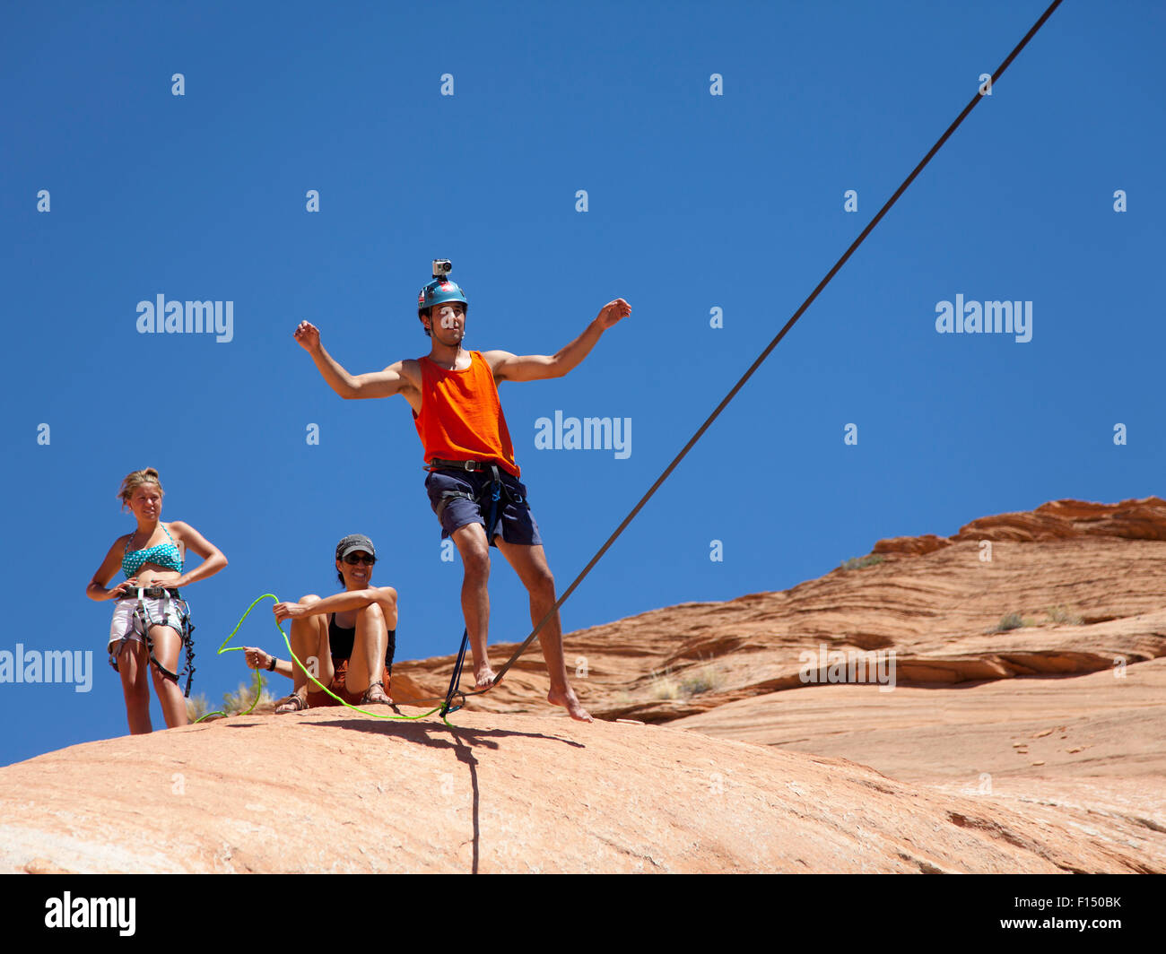 USA, Utah, Lake Powell, Man balancing on rope between rocks Stock Photo ...