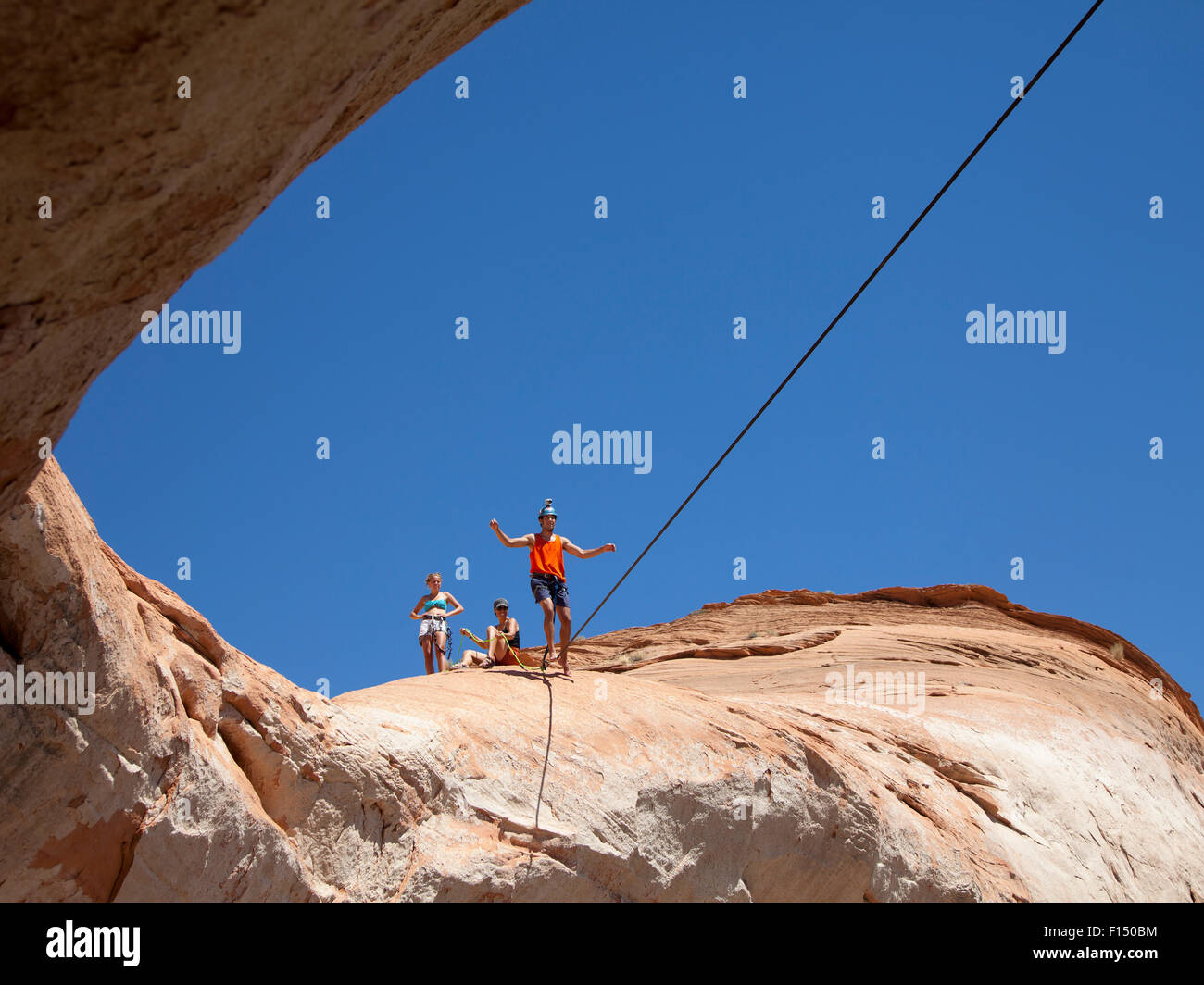 USA, Utah, Lake Powell, Man balancing on rope between rocks Stock Photo ...