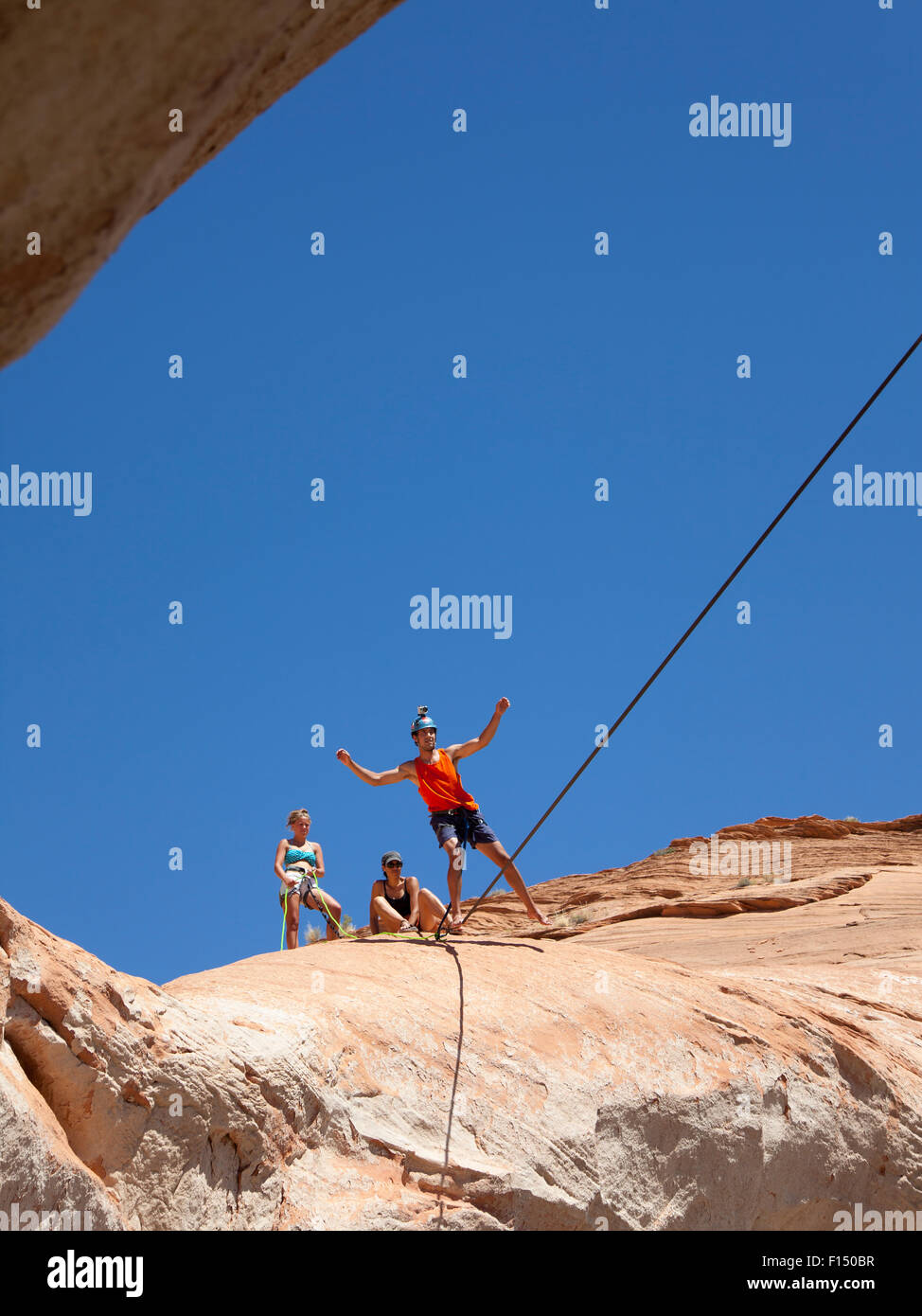 USA, Utah, Lake Powell, Man balancing on rope between rocks Stock Photo ...