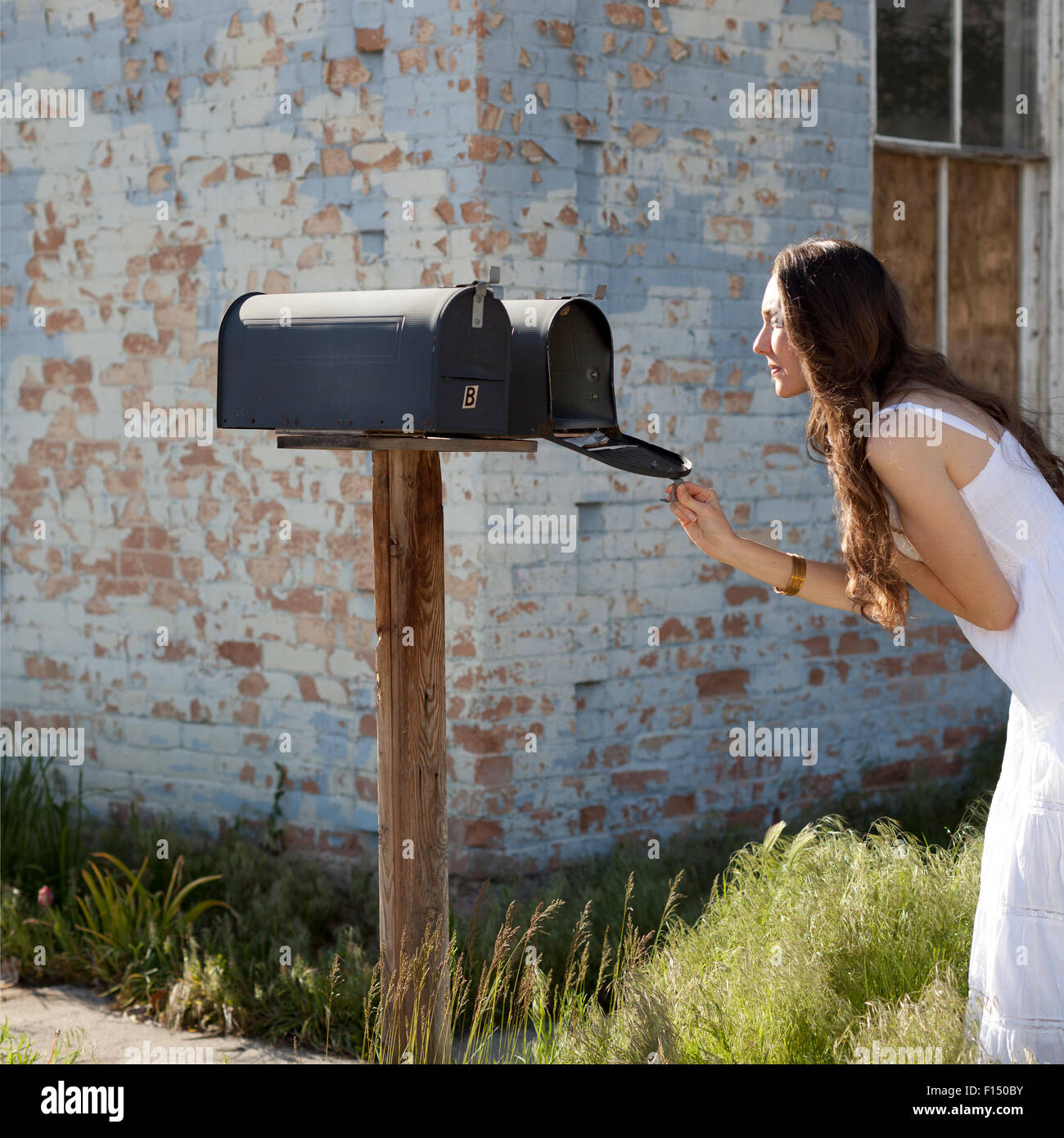 Mailbox woman hi-res stock photography and images - Alamy