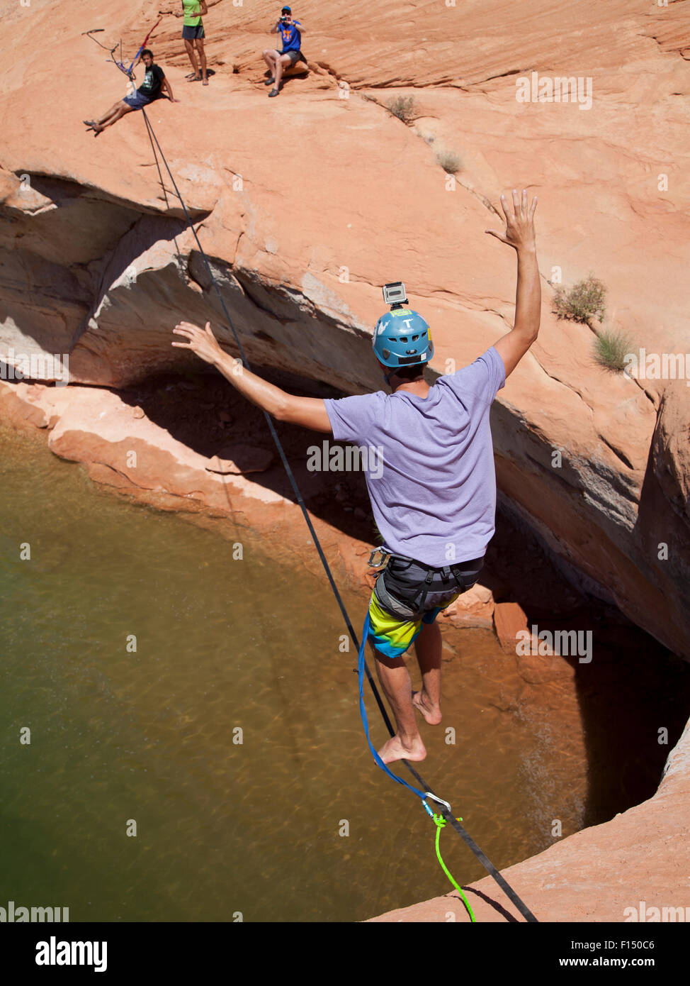 USA, Utah, Lake Powell, Man balancing on rope between rocks Stock Photo ...