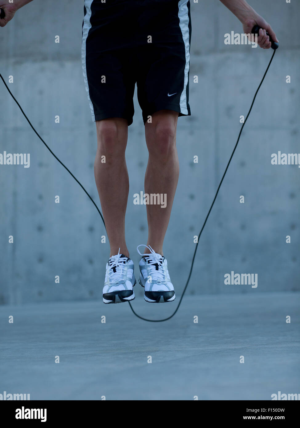 Man jumping on jump rope hi-res stock photography and images - Alamy
