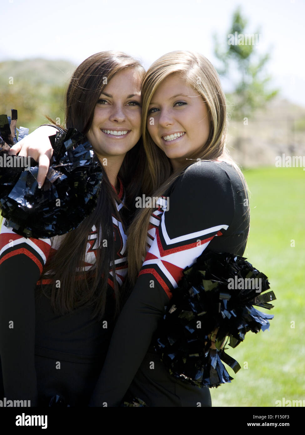 USA, Utah, American Fork, Portrait of two cheerleaders hugging Stock ...