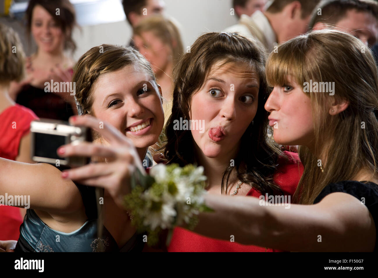 USA, Utah, Cedar Hills, Teenage girls (14-17) photographing themselves ...