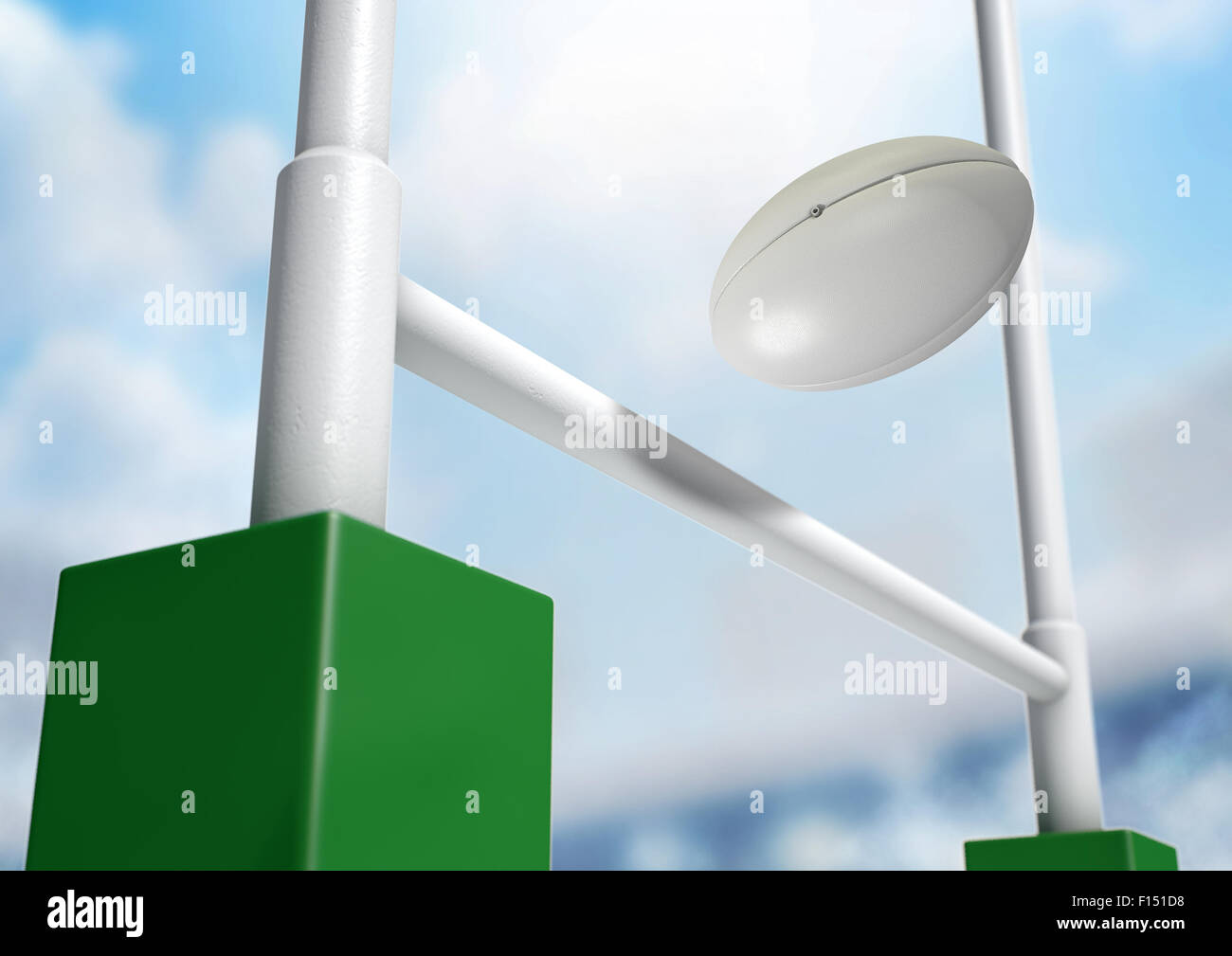 A closeup of rugby ball flying between rugby posts in a stadium under a ...