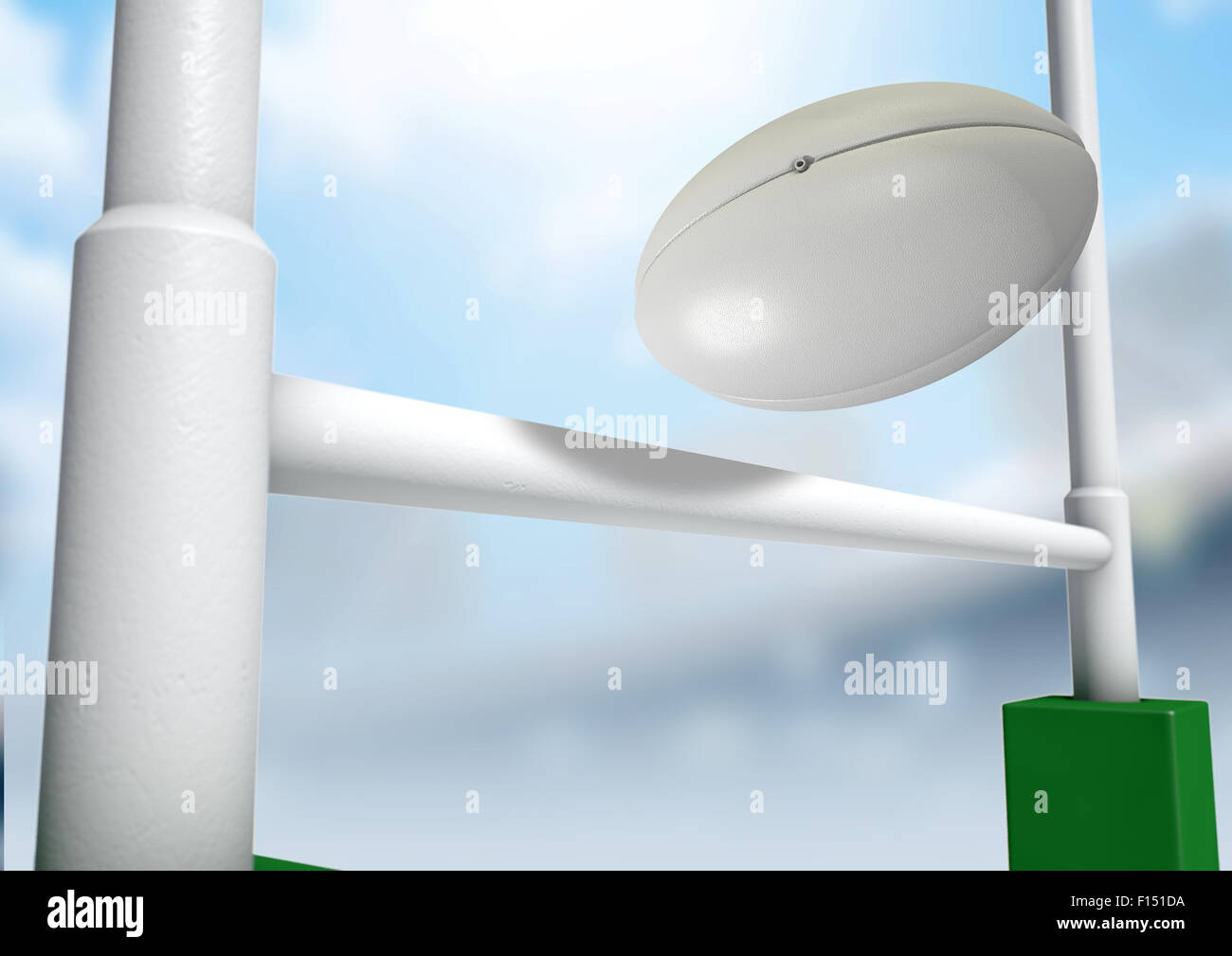 A closeup of rugby ball flying between rugby posts in a stadium under a ...