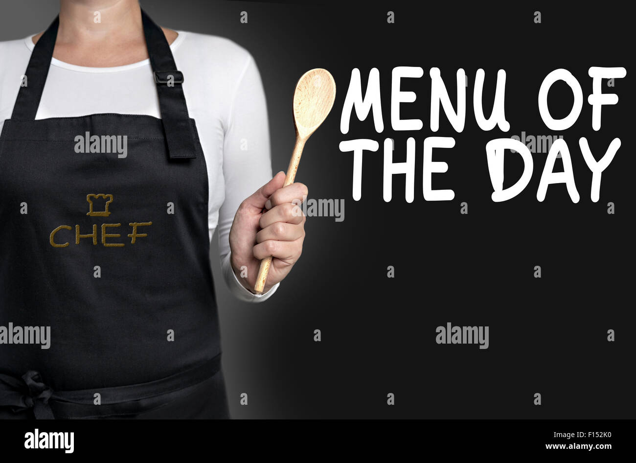 Menu of the day cook holding wooden spoon background Stock Photo - Alamy