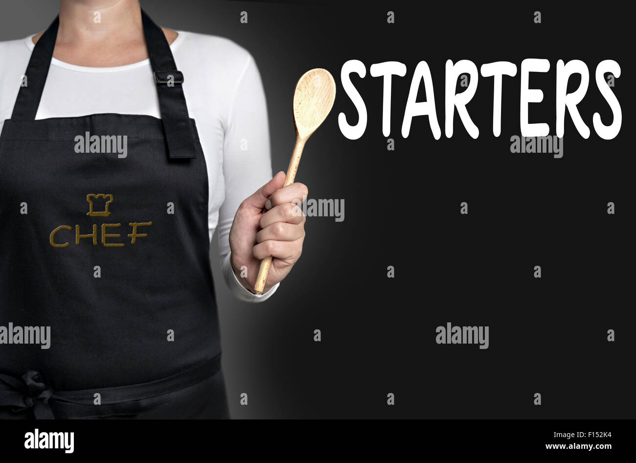 starters cook holding wooden spoon background Stock Photo - Alamy
