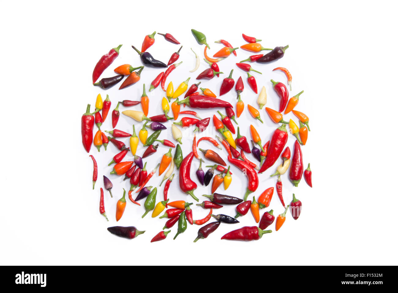 hot pepper mix on white background Stock Photo - Alamy