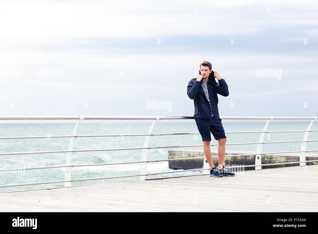 Portrait of a young sports man standing outdoors Stock Photo - Alamy
