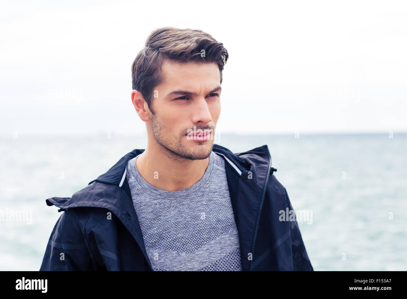 Serious man standing outdoors hi-res stock photography and images - Alamy