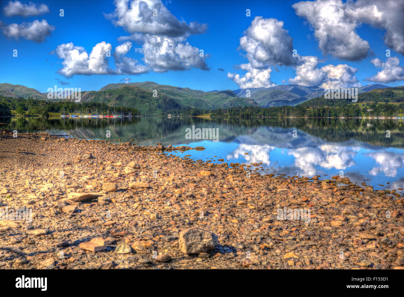 Beautiful Lake District scene at Ullswater with mountains and blue sky ...