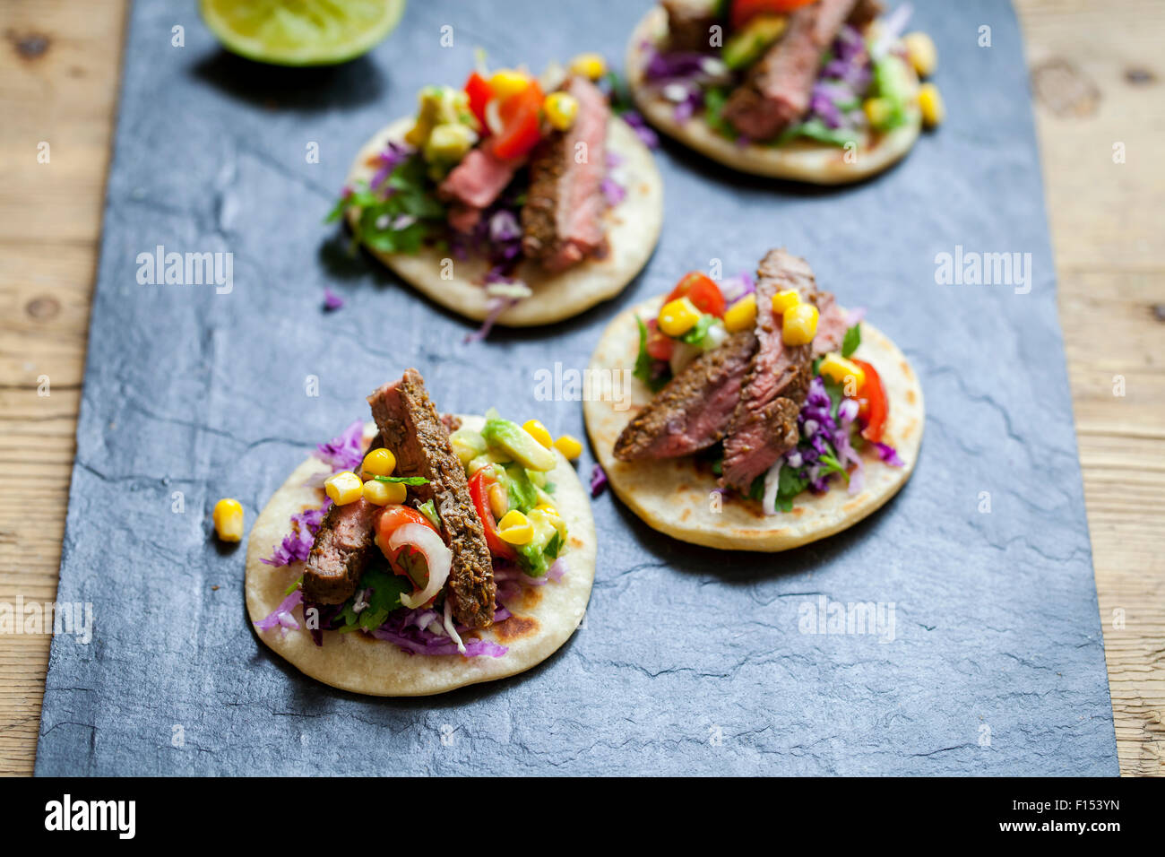 Mini beef steak tortillas Stock Photo - Alamy