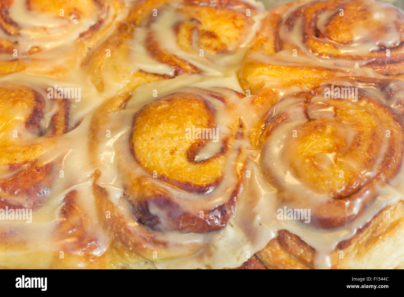 Closeup of several cinnamon buns on display at local bakery Stock Photo ...