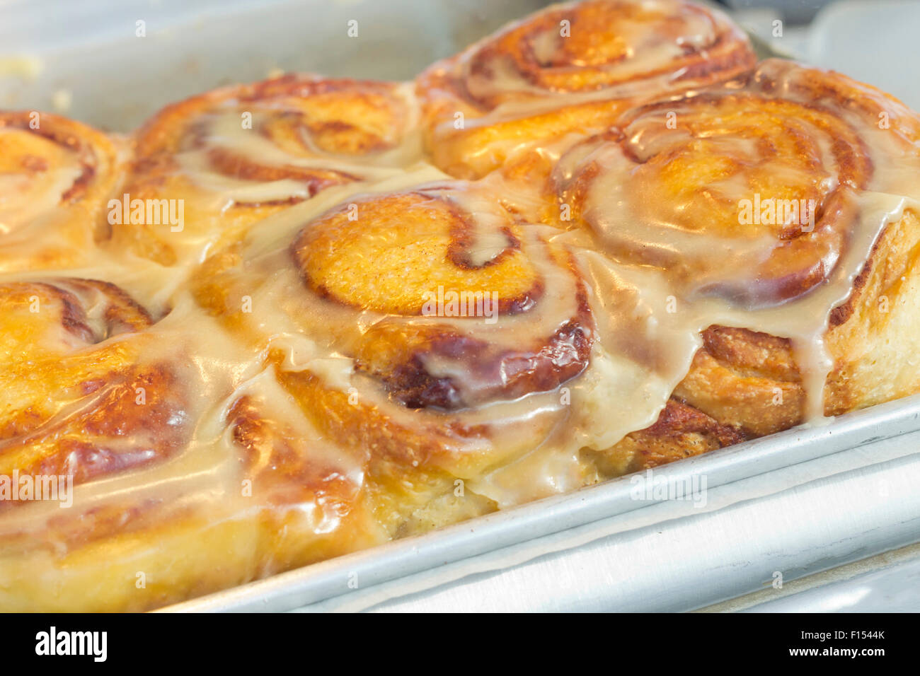 Closeup of several cinnamon buns on display at local bakery Stock Photo ...