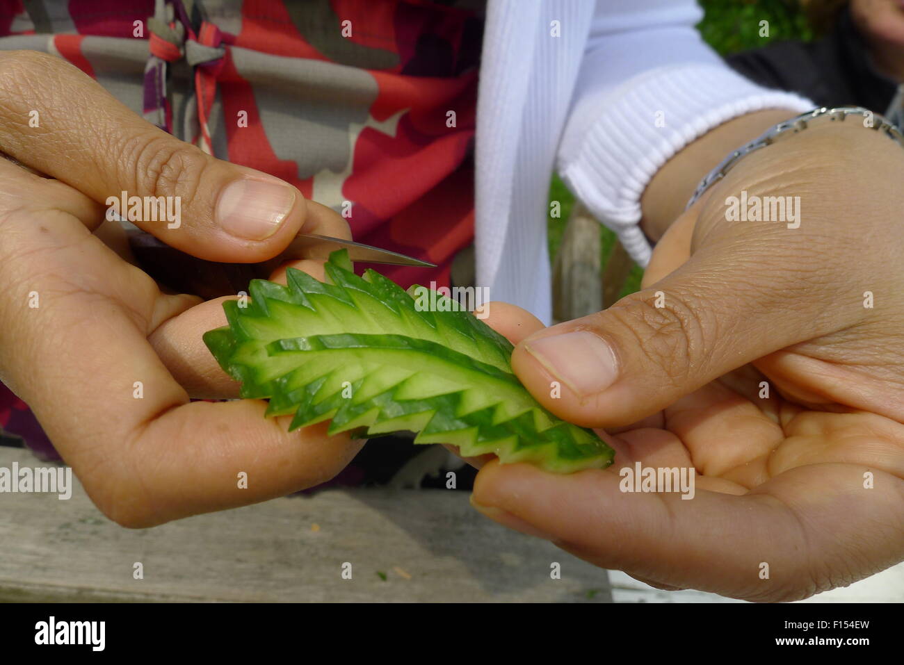 hands cutting a cucumber Stock Photo - Alamy