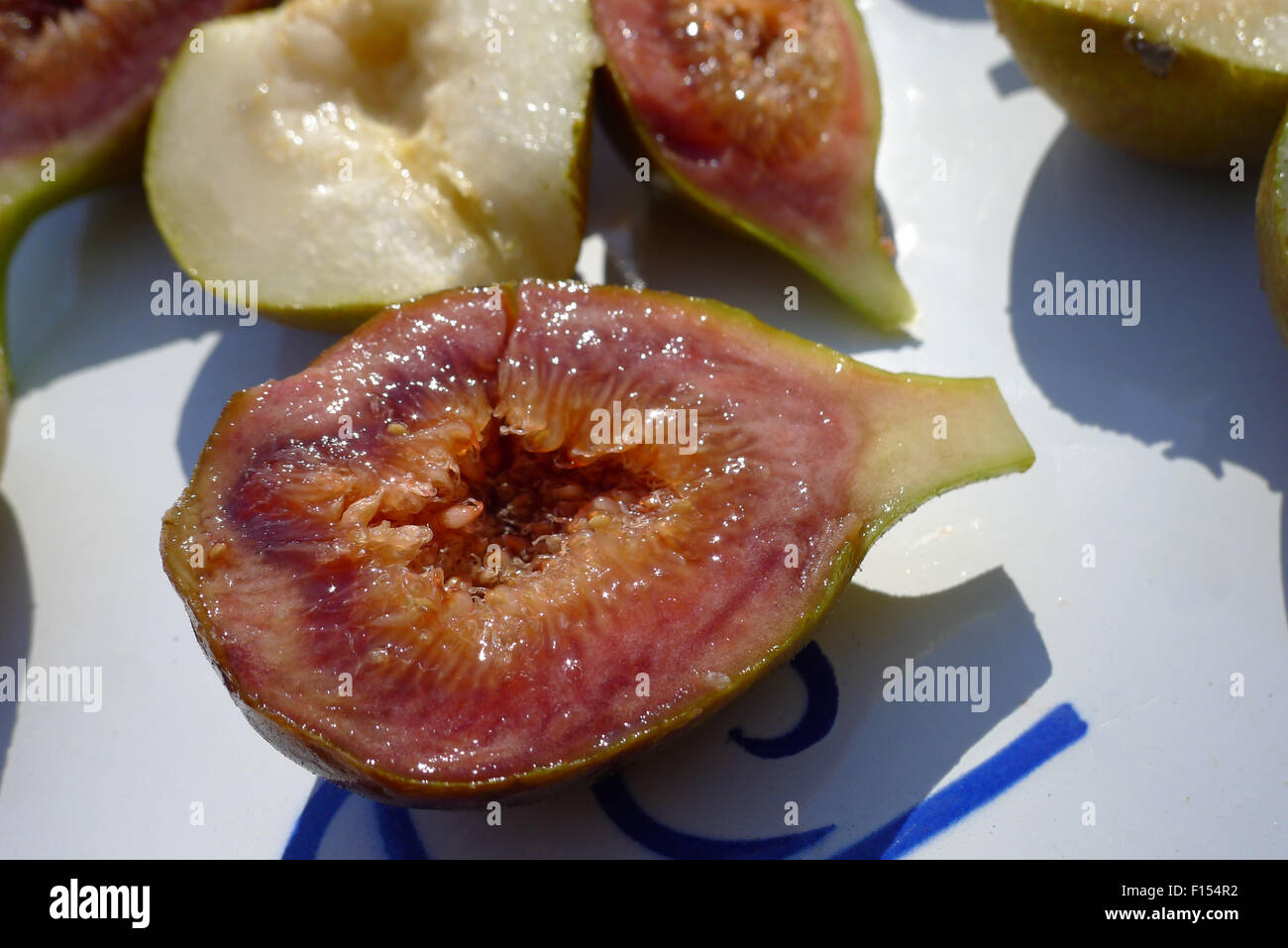 cut fig on a plate Stock Photo - Alamy