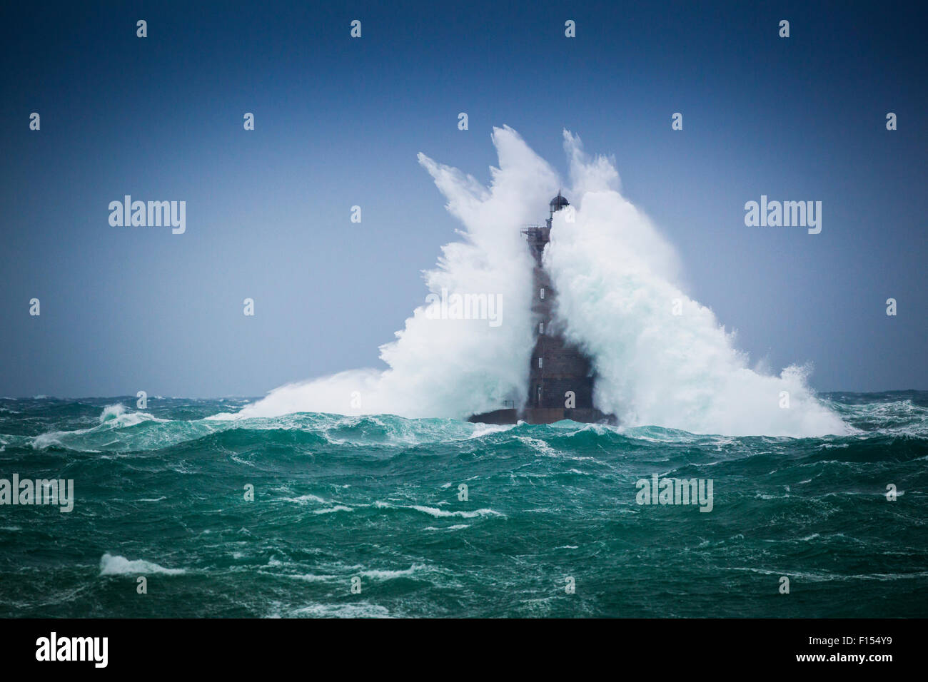 Waves lashing the Four Lighthouse during winter storm, Northern ...