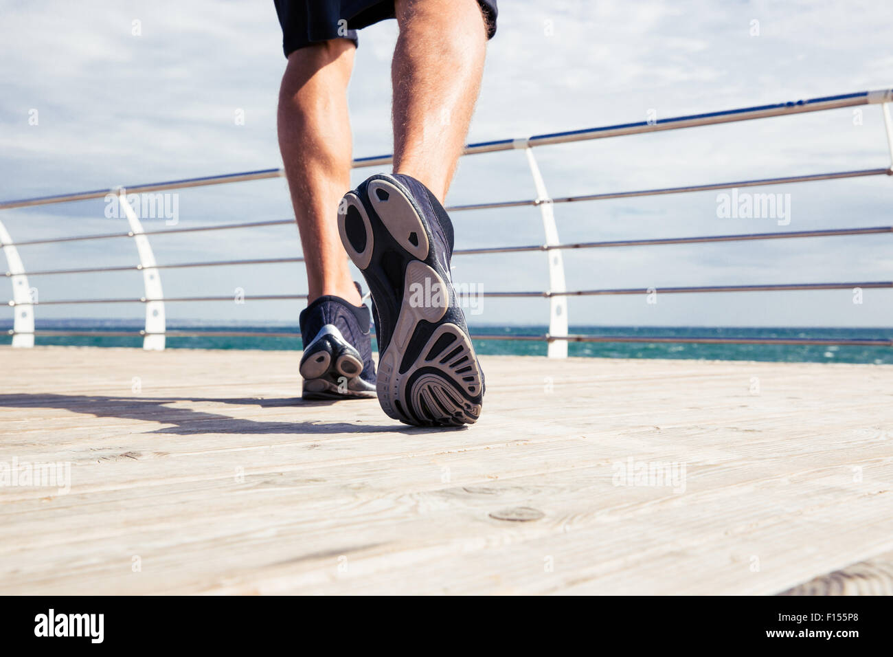 Closeup portrait of a runner male legs Stock Photo - Alamy