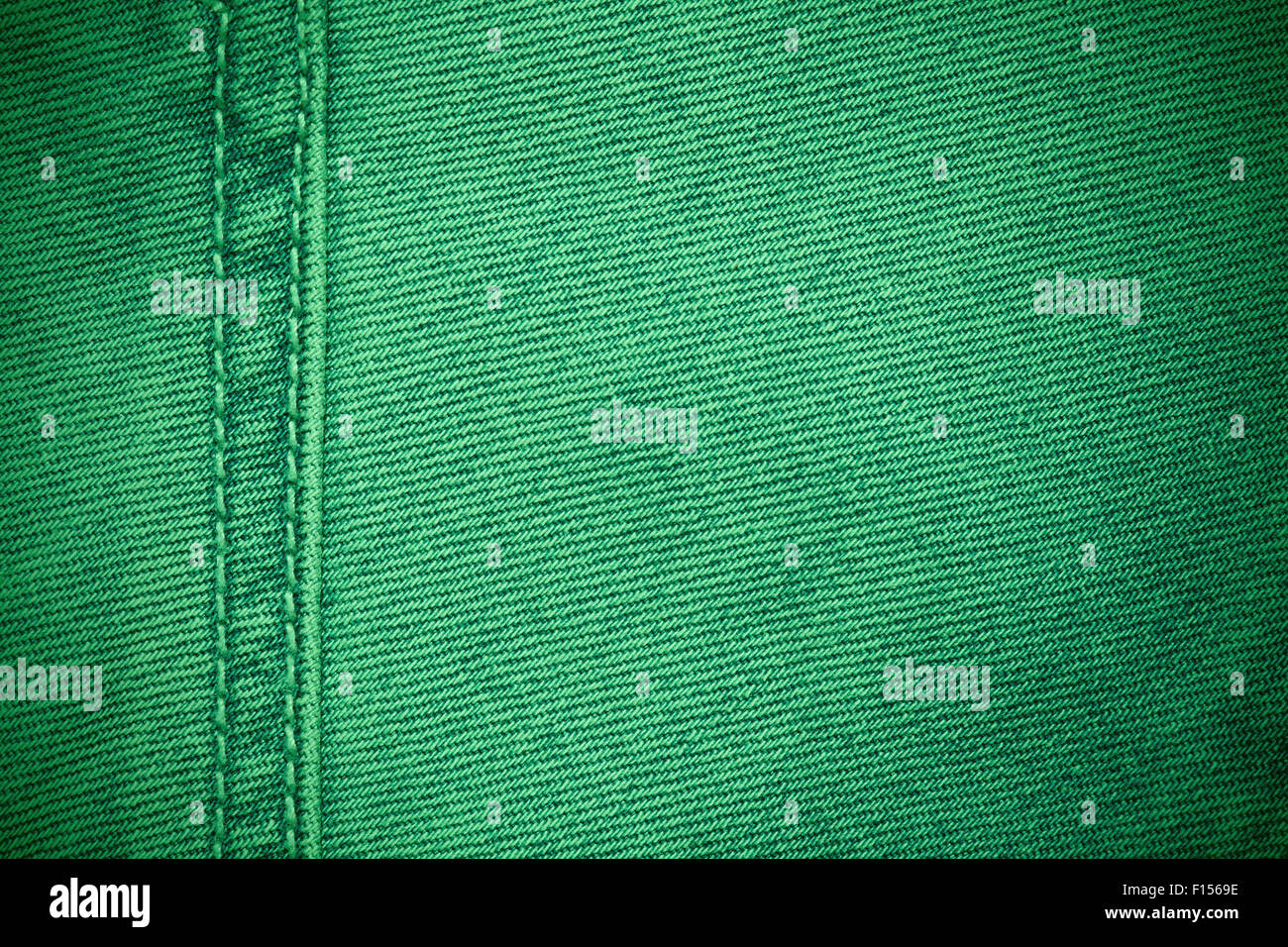 green jeans background or cotton texture with seam Stock Photo - Alamy