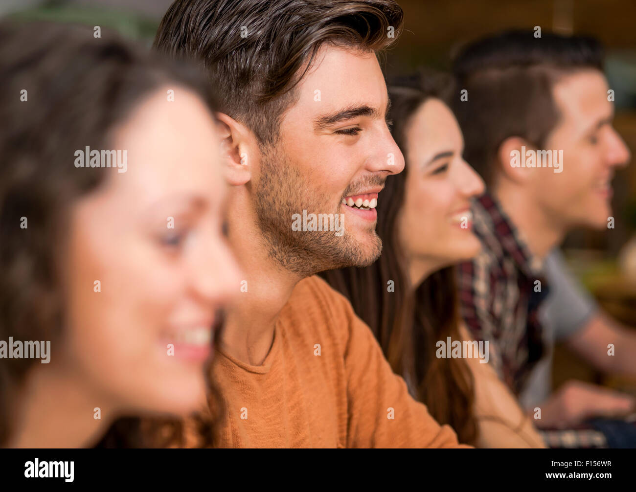 Multi-Ethnic Group of happy friends having fun at the restaurant Stock ...