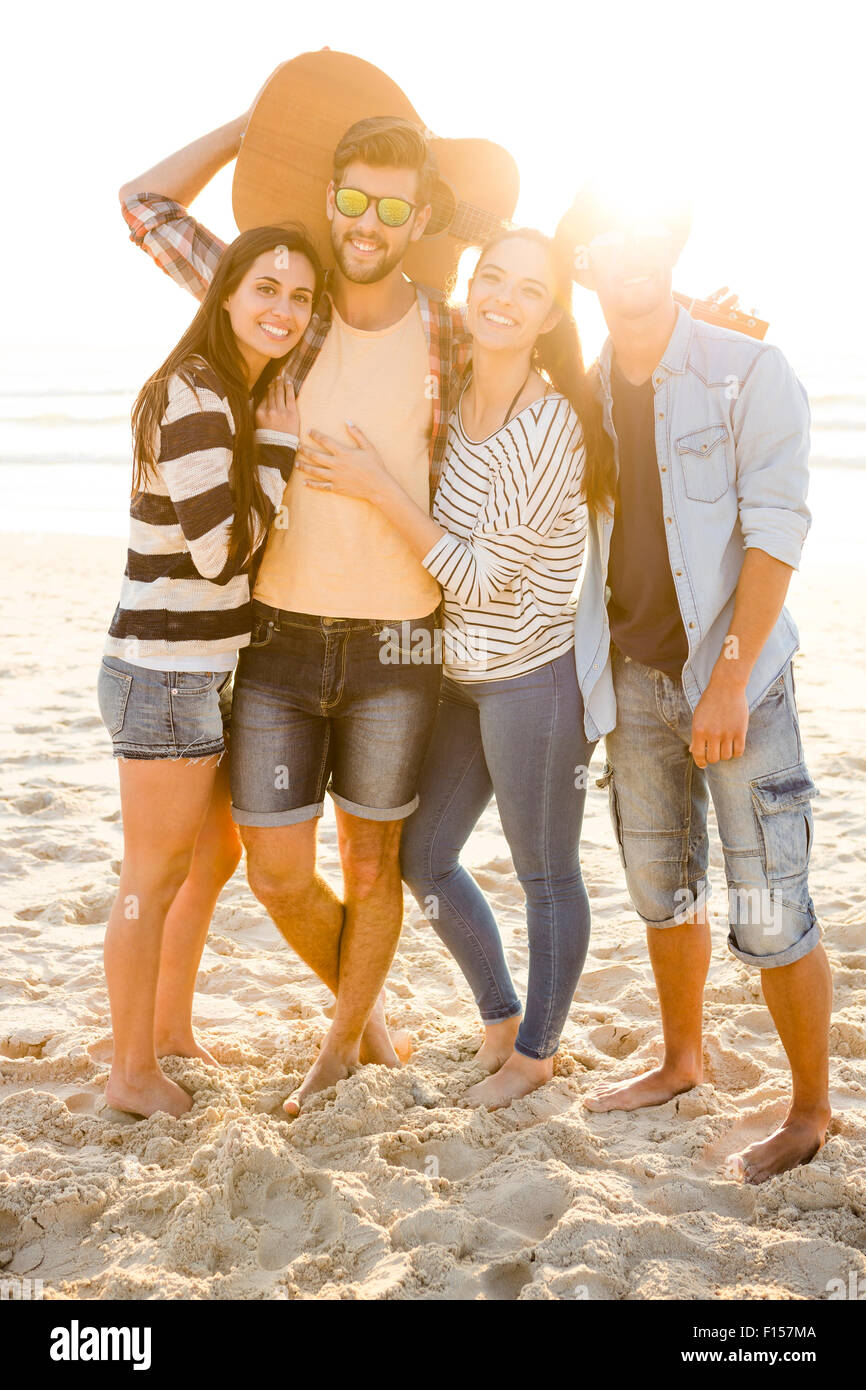 Friends at the beach having fun together Stock Photo - Alamy