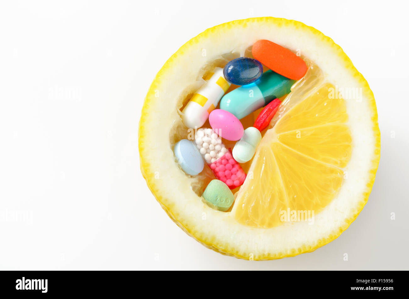 pills and lemon isolated on white background Stock Photo - Alamy