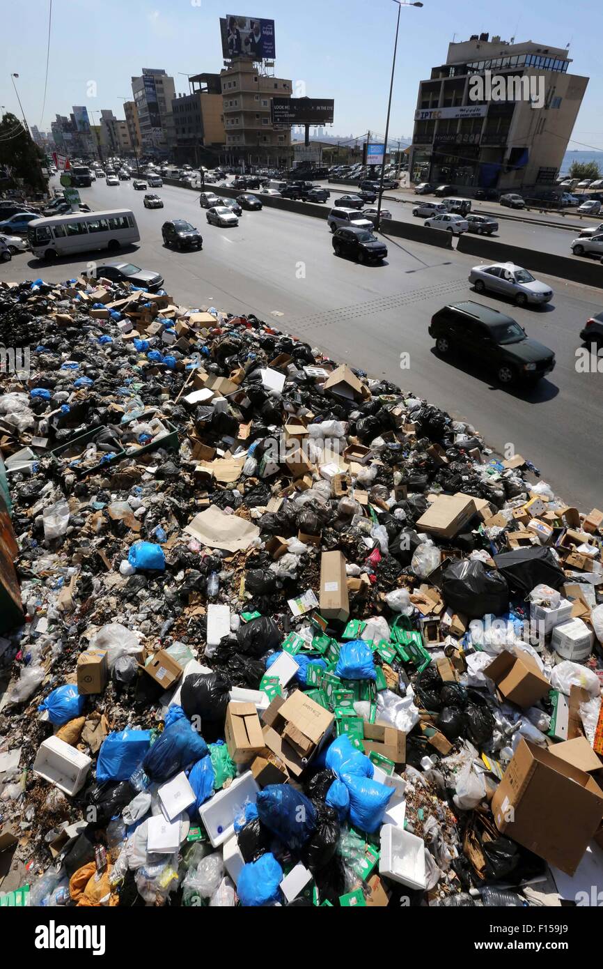 Beirut, Beirut, Lebanon. 27th Aug, 2015. People drive past piles of ...