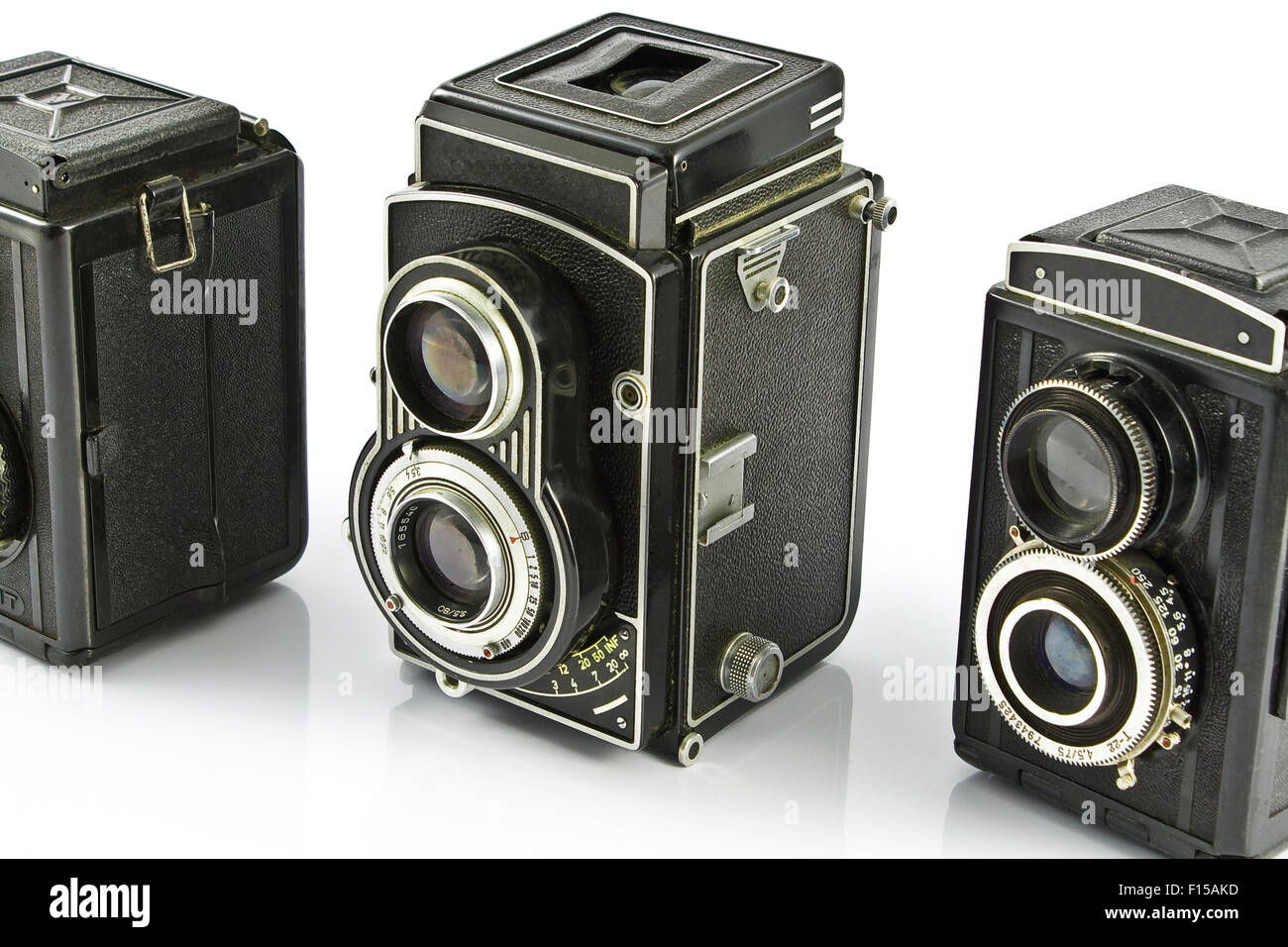 Three Vintage two lens photo camera isolated on white Stock Photo - Alamy