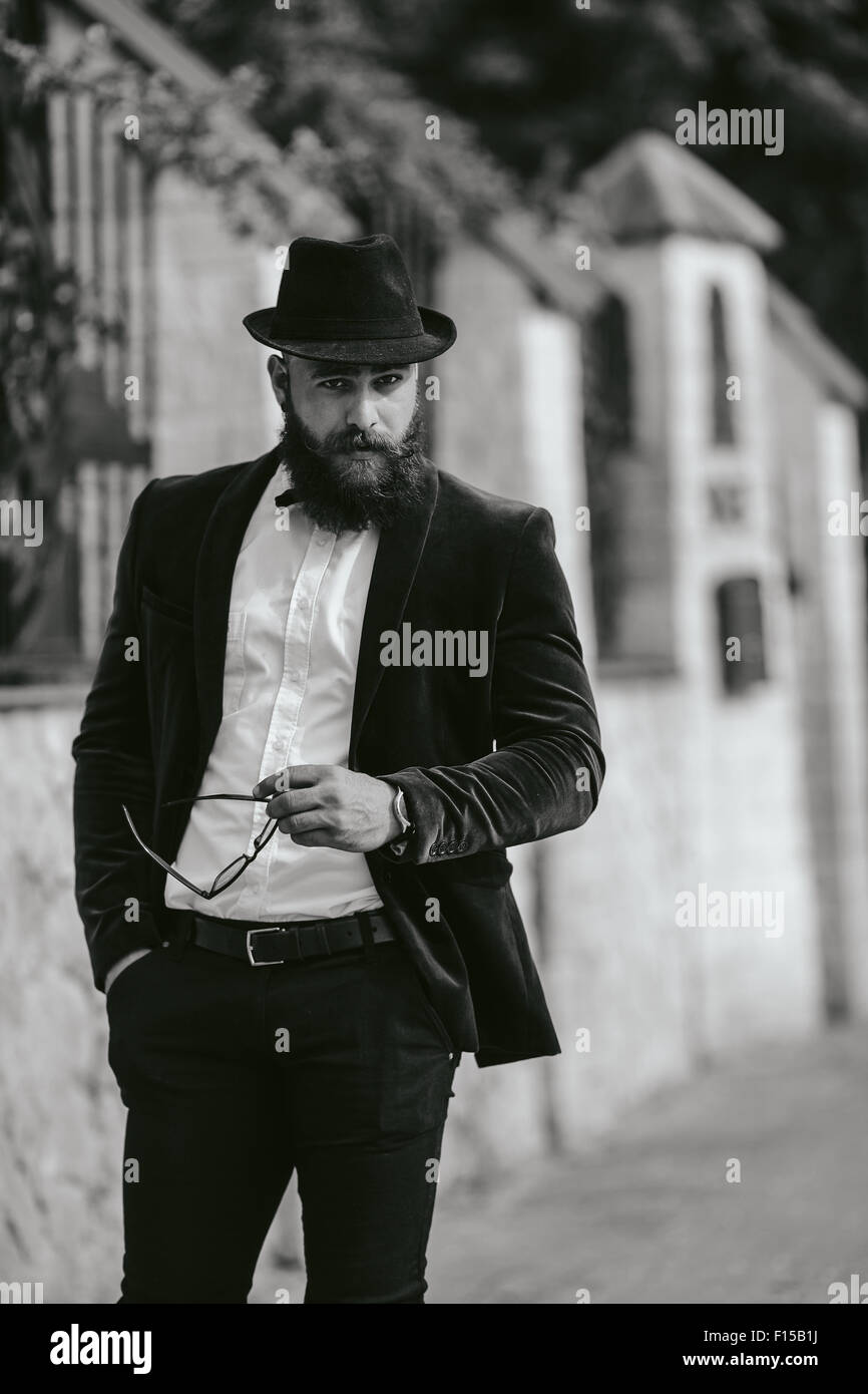 rich man with a beard, thinking about business Stock Photo - Alamy