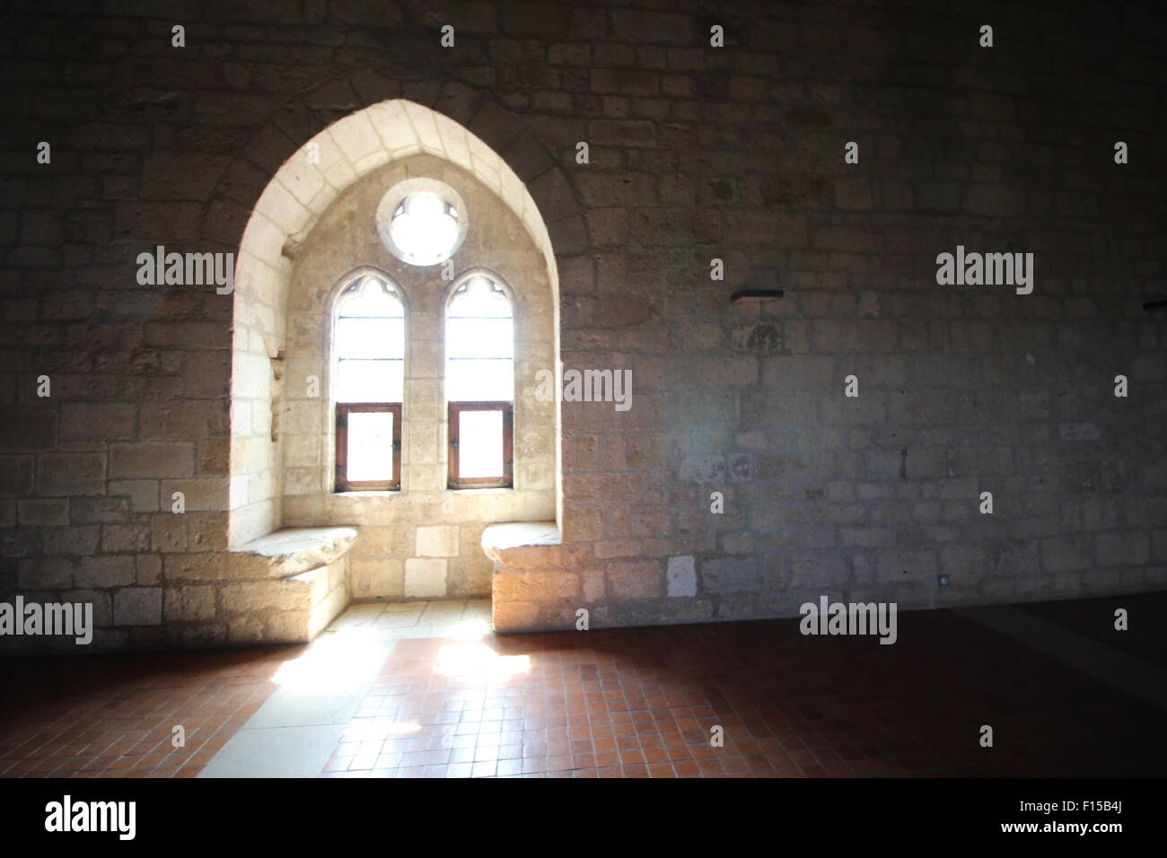 Medieval sunlit stone window seat in the chateau at Boudeilles Stock ...