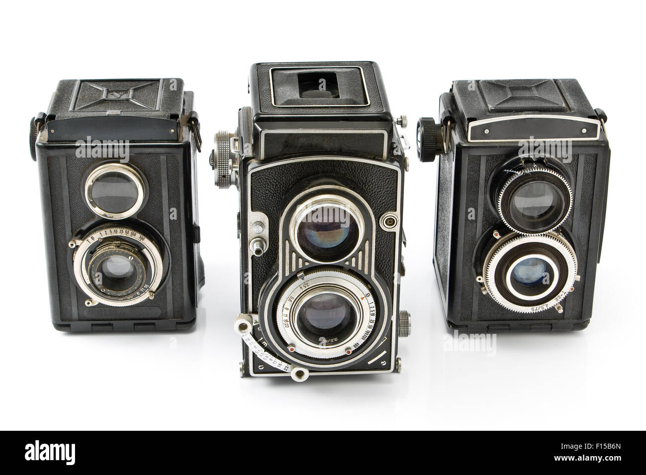 Three Vintage two lens photo camera isolated on white Stock Photo - Alamy