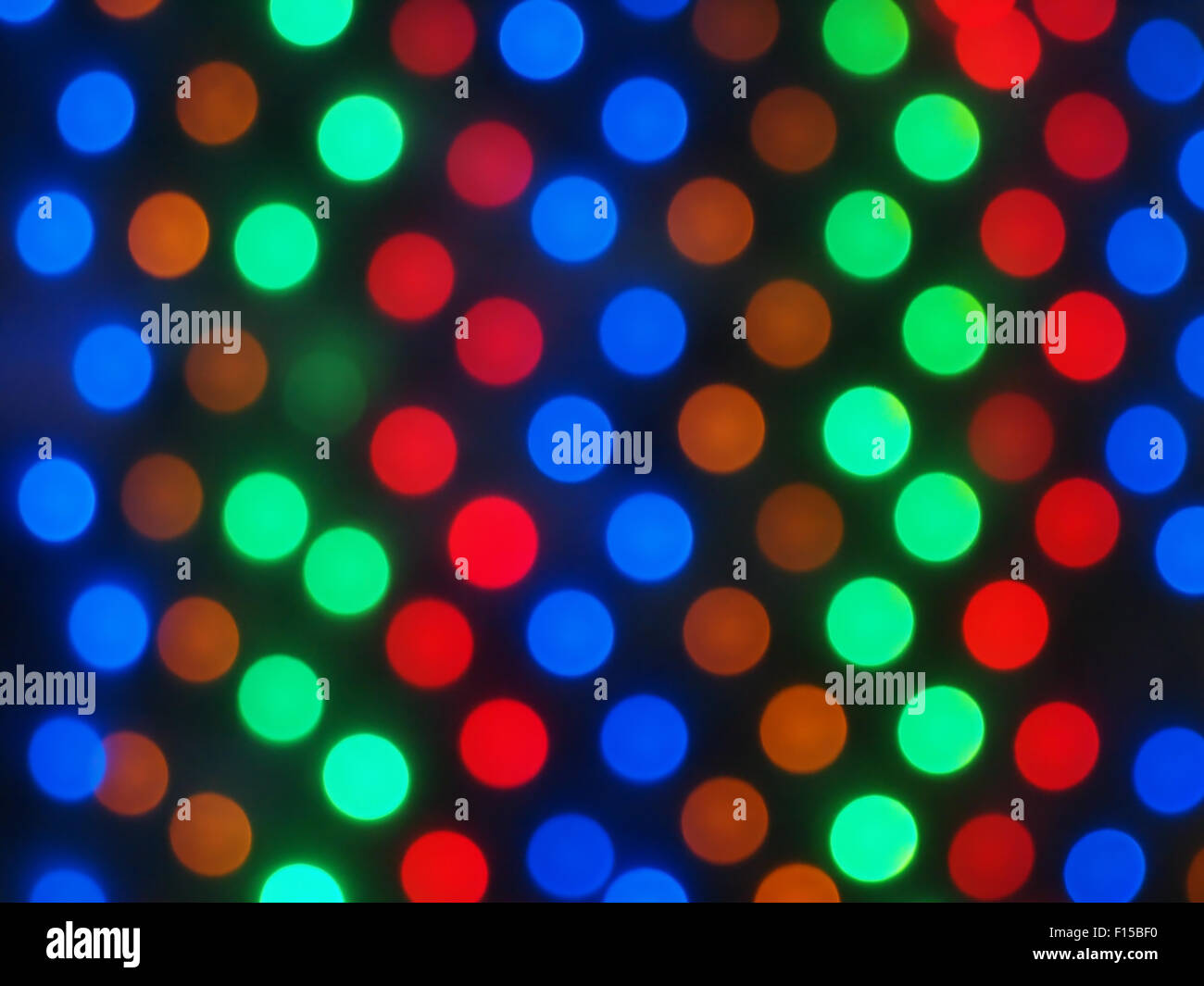 Defocused colored lights fill the entire frame with dark base was ...